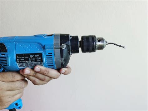 Premium Photo A Broken Bent Dill Bit In A Power Driver