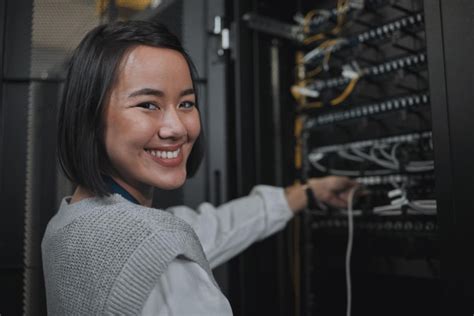Premium Photo Asian Woman Portrait Smile And Technician By Server For Networking Maintenance