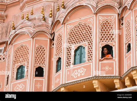 Woman Tourist At Hawa Mahal Windows Or Rahasthan Palace Of Winds Or