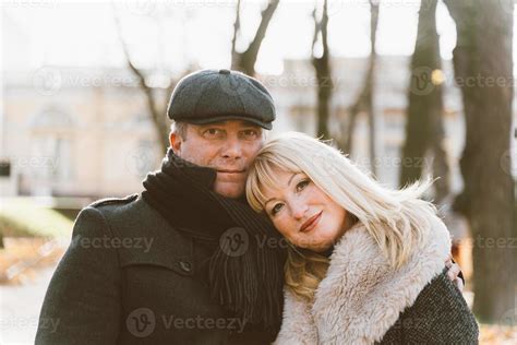 Happy Blonde Mature Woman And Handsome Middle Aged Brunette Man 7542498