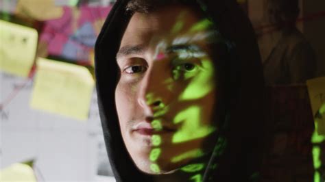 Free Stock Video Young Male Hacker In Hood Looking At Camera With