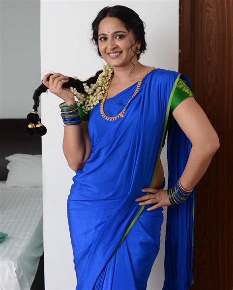 Indian Actress Anushka Shetty Long Hair Stills In Blue Saree Anushka
