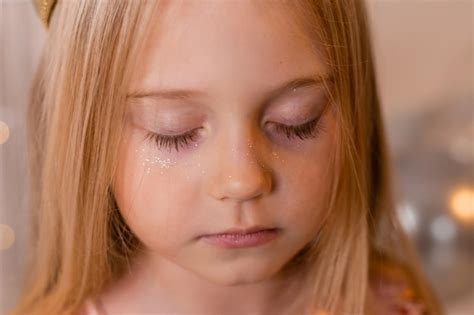Premium Photo A Young Girl With Tears On Her Face Is Crying