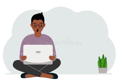 A Man Sits Cross Legged In His Hands Holding A Laptop The Concept Of