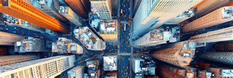 Highway Intersecting Vibrant Urban Landscape With Dense Traffic In
