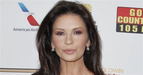 Catherine Zeta Jones Flaunts Age Defying Beauty In Plunging Dress Daily Star