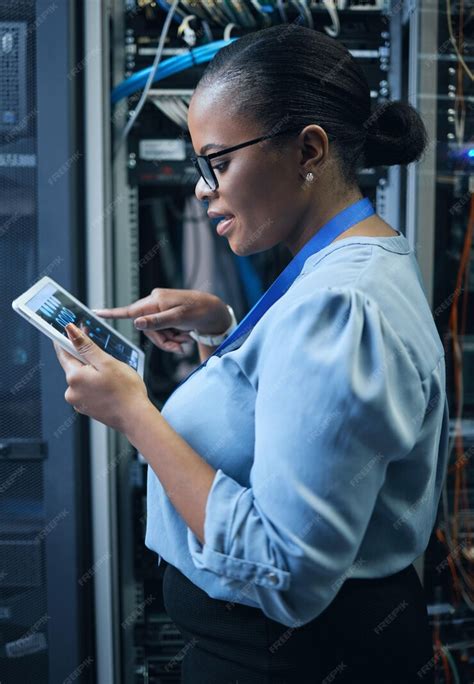 Premium Photo It Woman Engineer And Tablet In A Server Room For Programming Cybersecurity Or