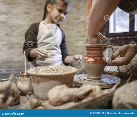 Girl Playing With Modeling Clay On Pottery Wheel At Workshop Craft Art Artisan Hobby And
