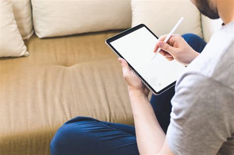 male using stylus on tablet to draw stock image image of copy office