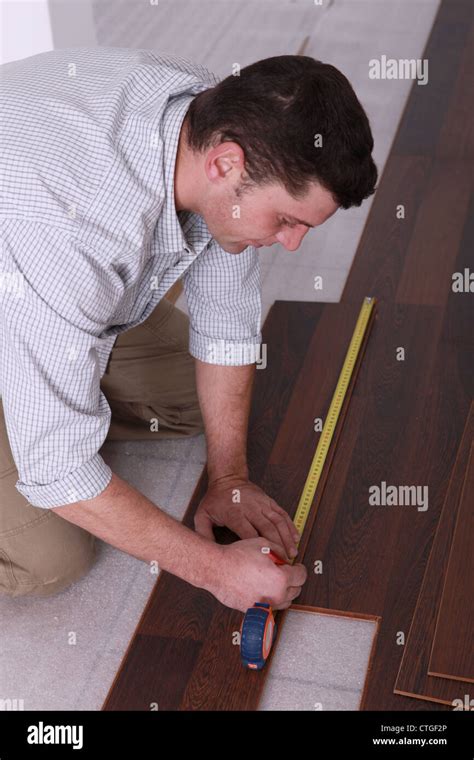 Man Using A Measuring Tape Stock Photo Alamy