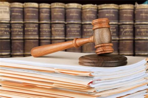 Premium Photo Judge Wooden Hammer And Stack Documents