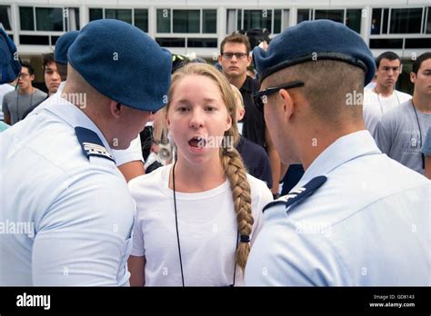 A First Class Cadet Yells Orders At A Newly Arrived Incoming Freshman