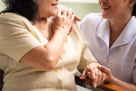 Close Up Of Nurse Comforting Female Patient In The Room 11556658 Stock