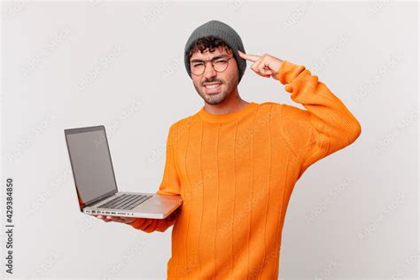 Nerd Man With Computer Feeling Confused And Puzzled Showing You Are Insane Crazy Or Out Of