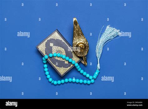 Aladdin Lamp Of Wishes Koran And Prayer Beads For Ramadan On Blue