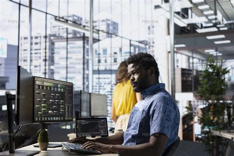 Programmer Developing And Maintaining Machine Learning Apis Stock