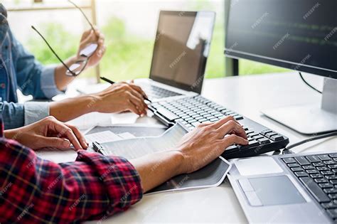 Premium Photo Programmer Working In A Software Development And Coding Technologies Website