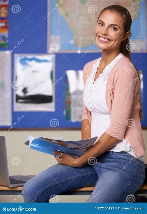 I Feel At Home In A Classroom A Beautiful Young Teacher Sitting On The