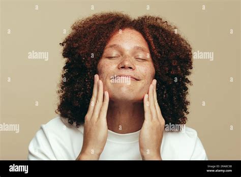 Man Embracing His Freckles And Feeling Good In His Own Skin After Completing His Skincare
