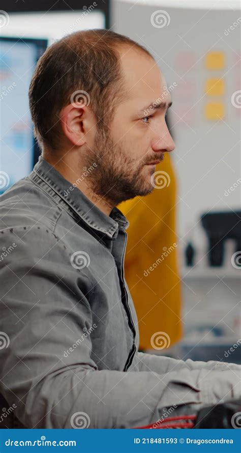 Videographer Looking At Camera Smiling Working In Creative Startup Workplace Stock Image Image