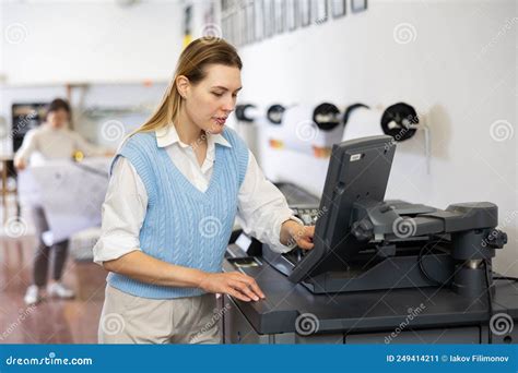 Technician Operator Calibrating Plotter Machine Typing On Computer