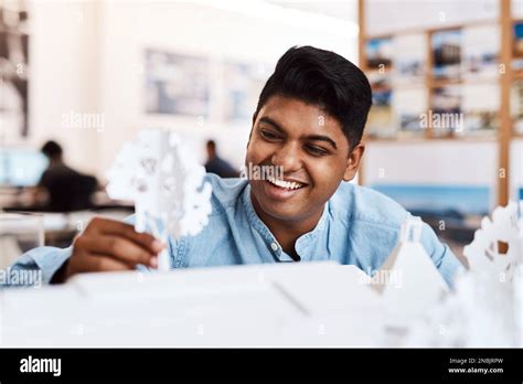 The Perfect Balance Between Beauty And Function A Young Architect Designing A Building Model In