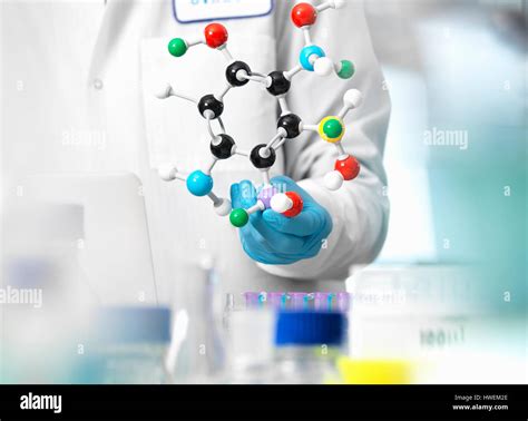 Researcher Using A Molecular Model To Understand A Chemical Formula In A Laboratory Stock Photo
