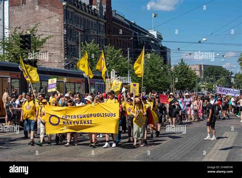 People With Banner Signs And Flags Marching For Intersex Rights At Helsinki Pride 2024 Parade
