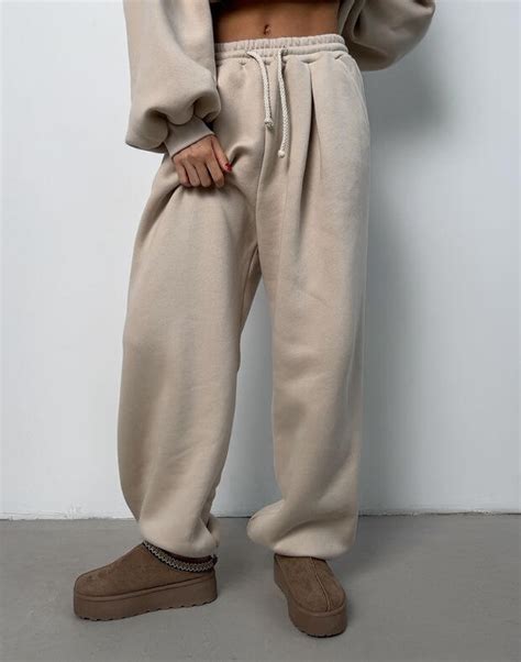 Джогери оверсайз з защіпами із тканини з діагональним плетінням кремові купити в Києві Штани