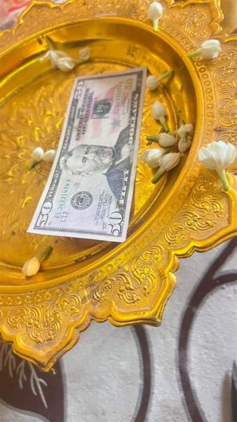 ល្បិចថ្មី យកលុយដុល្លារក្លែងក្លាយចូលបុណ្យតាមវត្ត រួចប្រើវិធីដូរលុយខ្មែរ