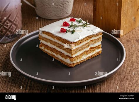 Sponge Cake Dessert On A Plate In A Coffee Shop On The Table Stock