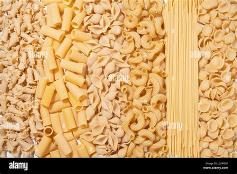 Different Types Of Raw Pasta On A Textile Background Stock Photo Alamy