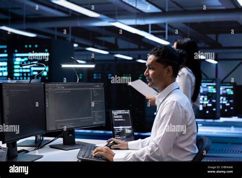 System Administrator In Data Center Checking Equipment Performance On Computer After Upgrading