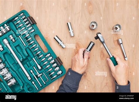 Man Working In Workshop Using Many Tools Wrench Spanner Calliper And Ratchet With Many