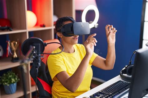 african american woman streamer playing video game using virtual