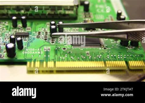 Tweezers Are Touch To The Board Microcircuit Diode Resistor