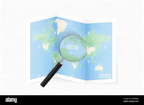 Enlarge Malta With A Magnifying Glass On A Folded Map Of The World Vector Paper Map Stock