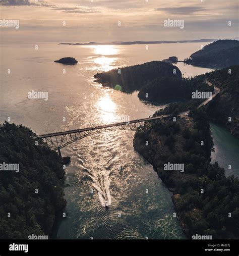 Helciopter View Of Deception Pass Bridge At Golden Hour With Colorful