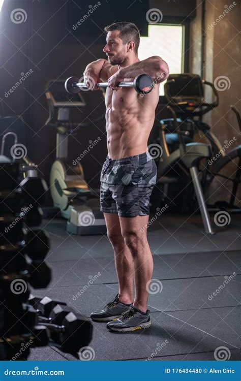 Muscular Man Doing Shoulders Exercise With Barbell Stock Photo Image Of Indoor Person 176434480