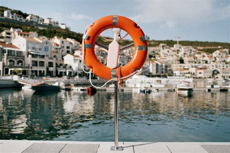 Lifebuoy On A Stand With A Latch Stands On A Pier In Lustica Bay
