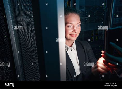 Cheerful Woman Network Engineer Working In Server Room Stock Photo Alamy
