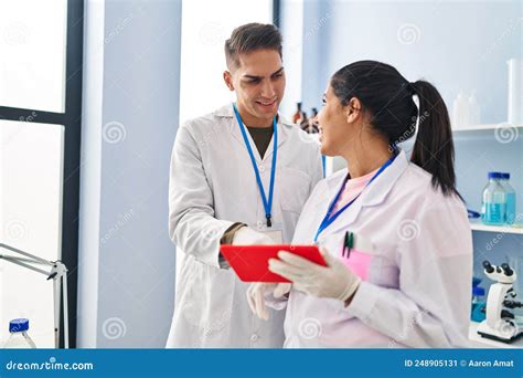 Man And Woman Scientists Partners Using Touchpad At Laboratory Stock Image Image Of Happy