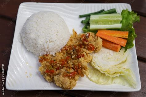 Ayam Geprek Indonesian Food Crispy Fried Chicken With Hot And Spicy Sambal Chili Sauce Served