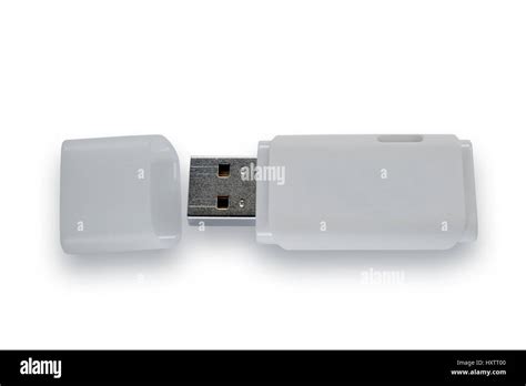 A White USB Memory Stick With Its Back Up On A White Background With The Lid Off Stock Photo