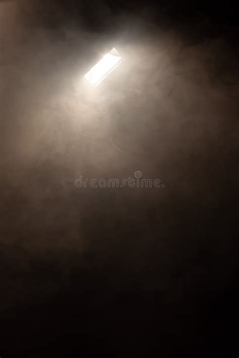 Big Spotlight Shining in Room Full of Smoke Stock Image - Image of ...