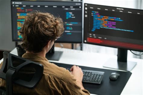 it developer working online software development coding on pc screens