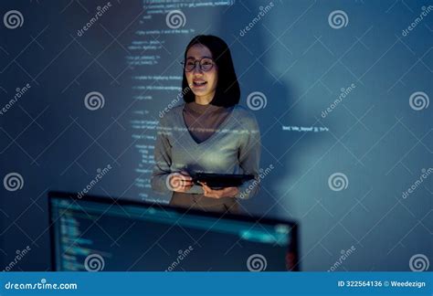 Asian Woman Programmer Standing In Front Of A Screen With Code Projected Presentation The