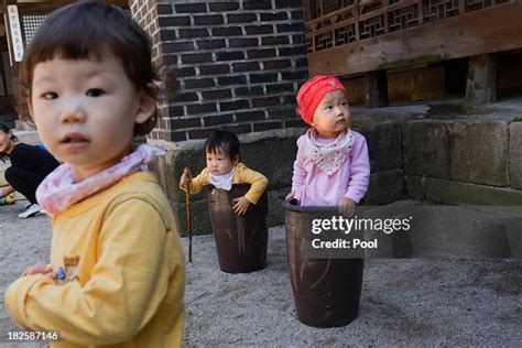 Jung Ha Yoon Stands Inside A Ceramic Container While Playing With News Photo Getty Images