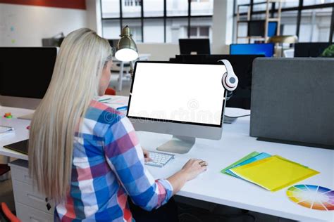 Man Using Desktop Computer Displaying A Graph Chart On Screen Stock