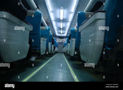 Executive Class Train Interior With Blue Seats Armrests Luggage Racks